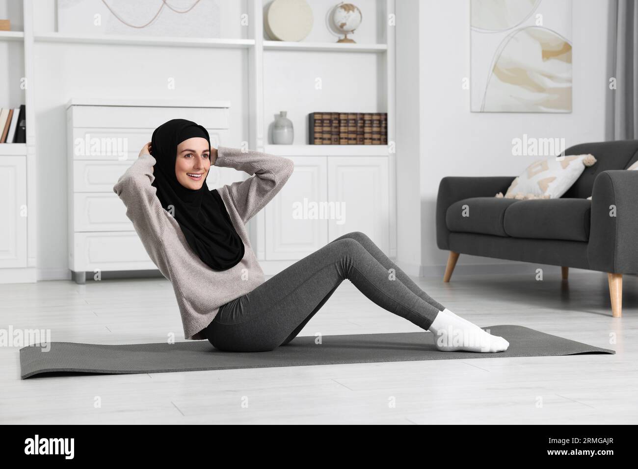 Woman wearing hijab exercise hi-res stock photography and images - Alamy