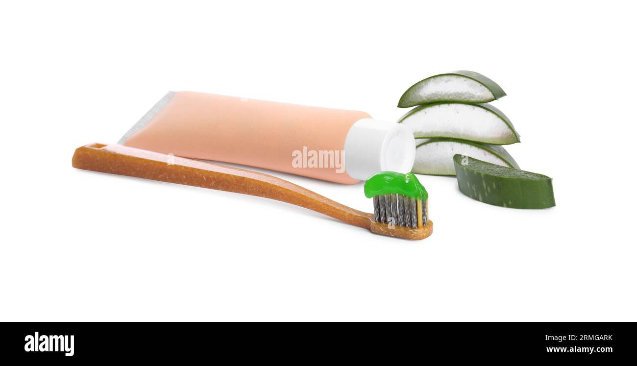 Tube of toothpaste, brush and cut aloe vera on white background Stock ...