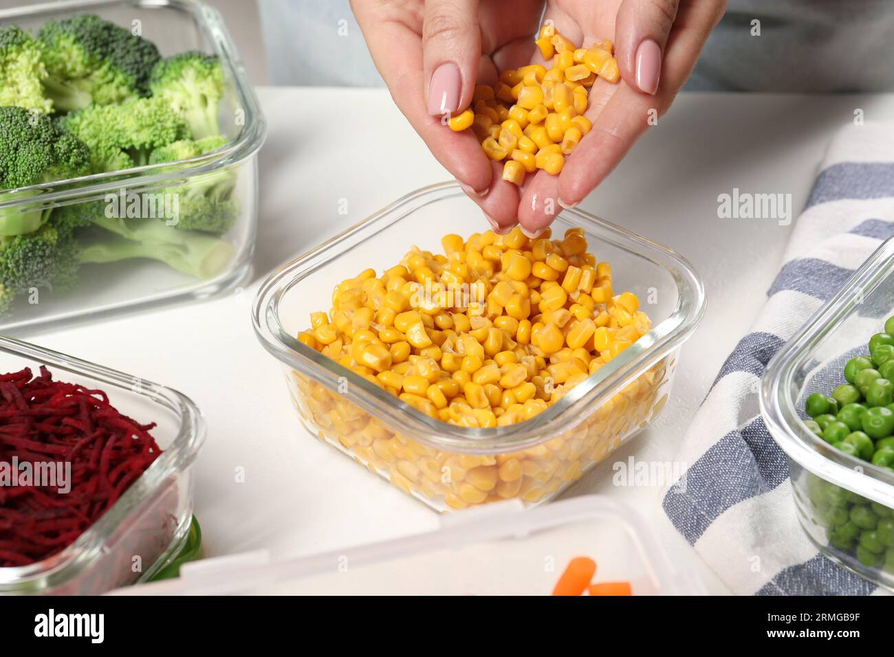 Woman putting corn glass hi-res stock photography and images - Alamy