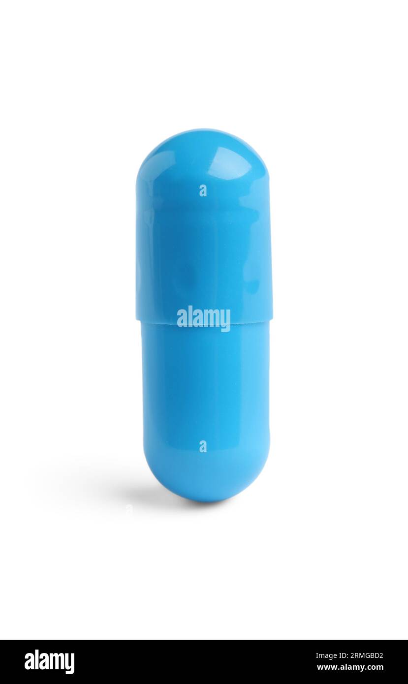 One light blue pill on white background. Medicinal treatment Stock ...