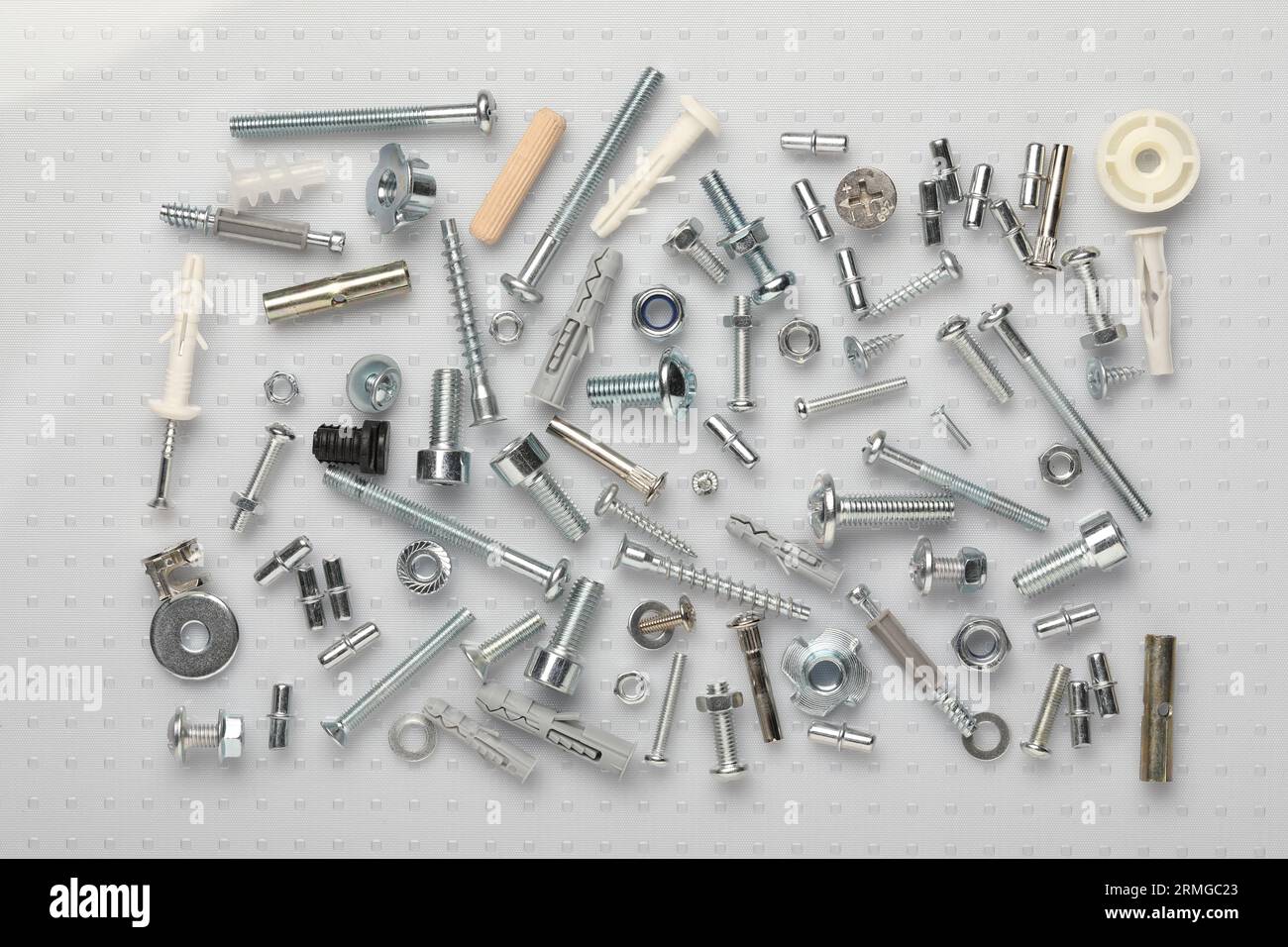 Many different fasteners on plastic surface, flat lay Stock Photo - Alamy