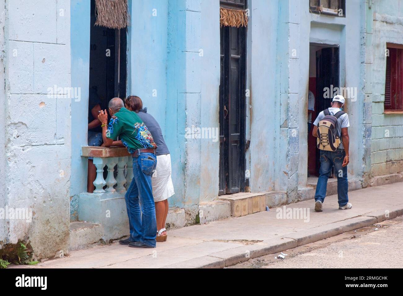 Havana, Cuba, 2023, Cuban people in a window Stock Photo - Alamy
