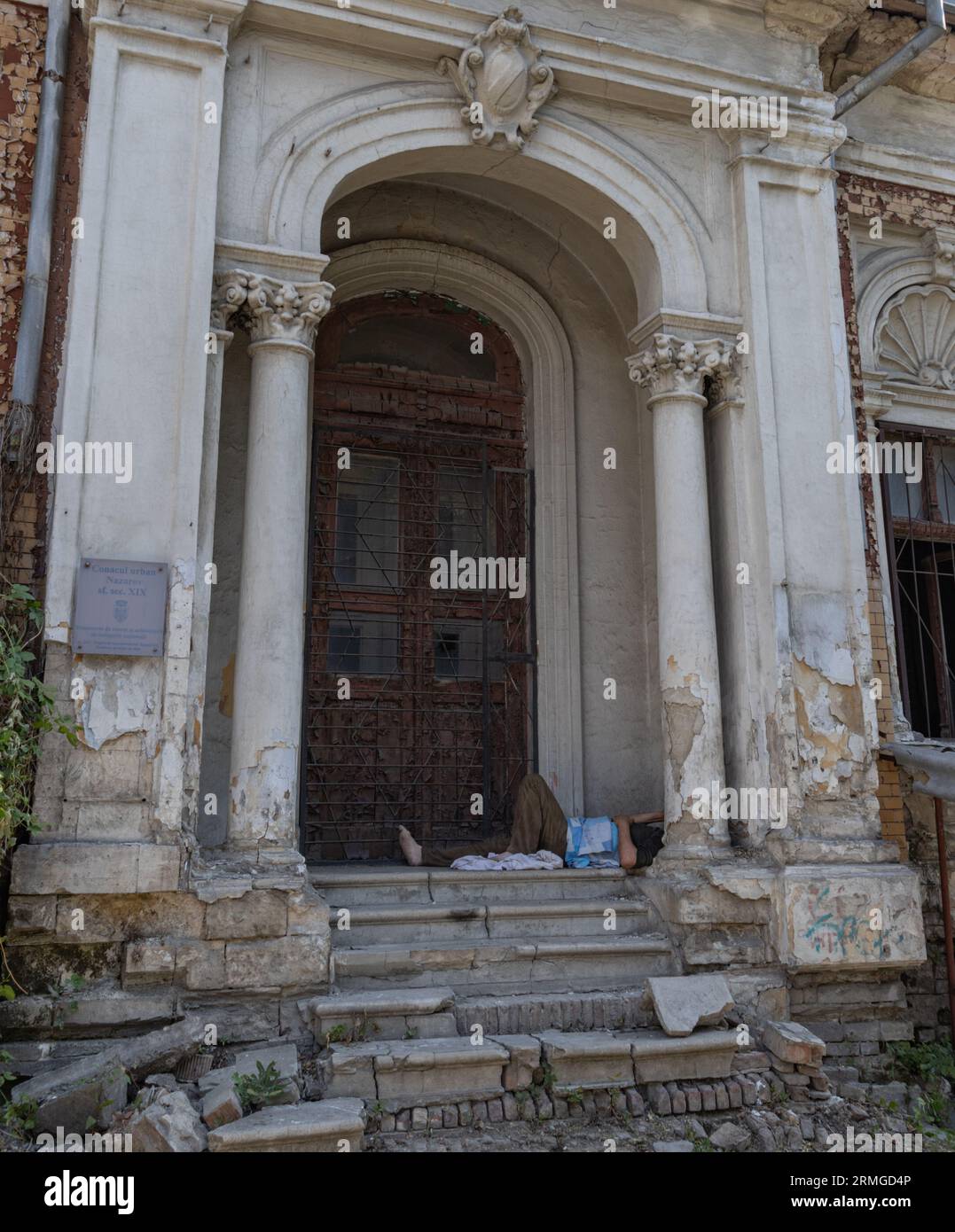 20 August 2023 - Chisinau city center, Moldova. Homeless man sleeping ...