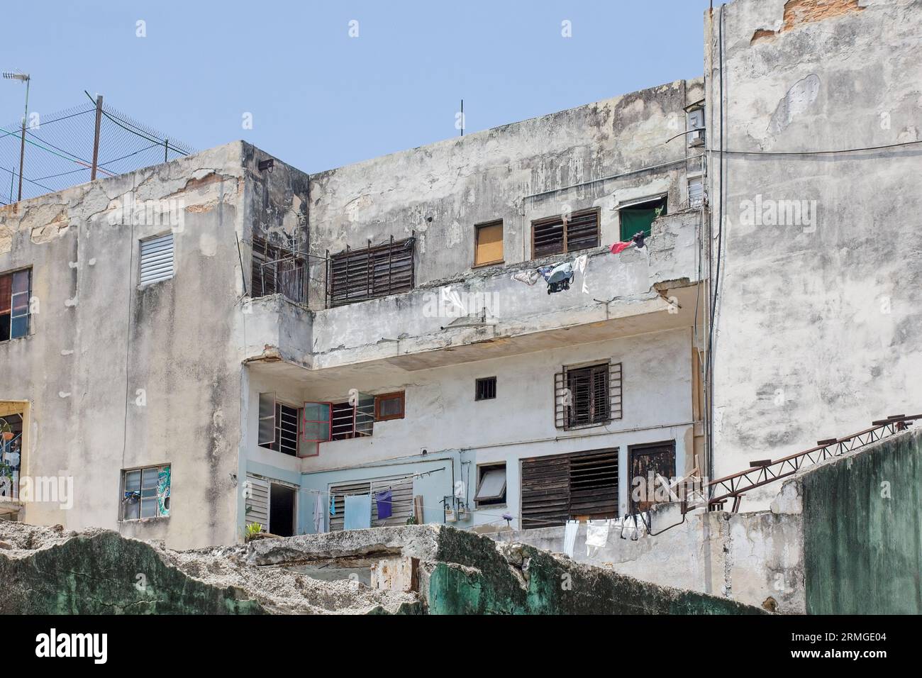 Havana, Cuba, 2023, Weathered and damaged apartment building facade ...