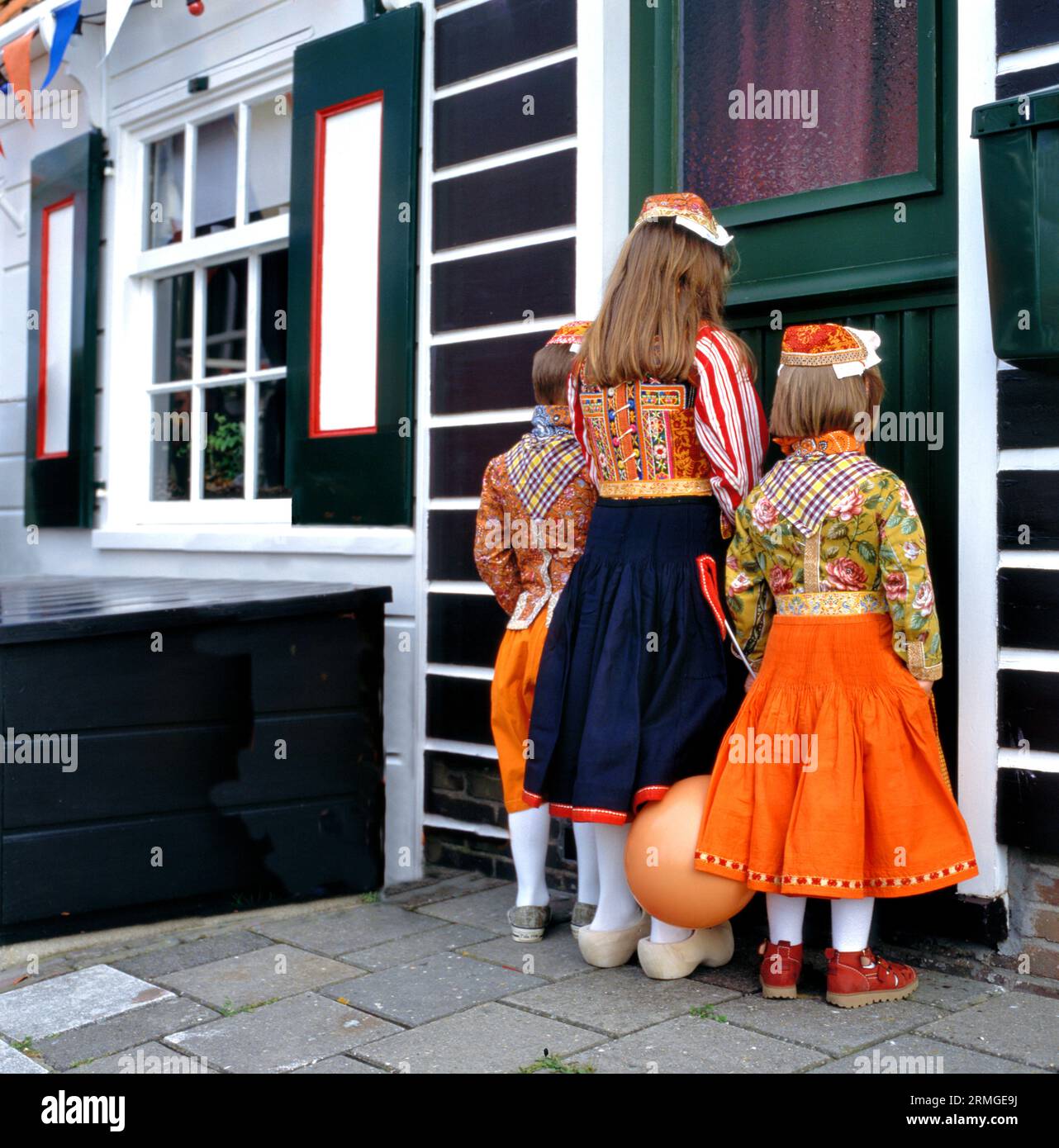 At Kingsday people at Marken are dressed in traditional costume. At ...