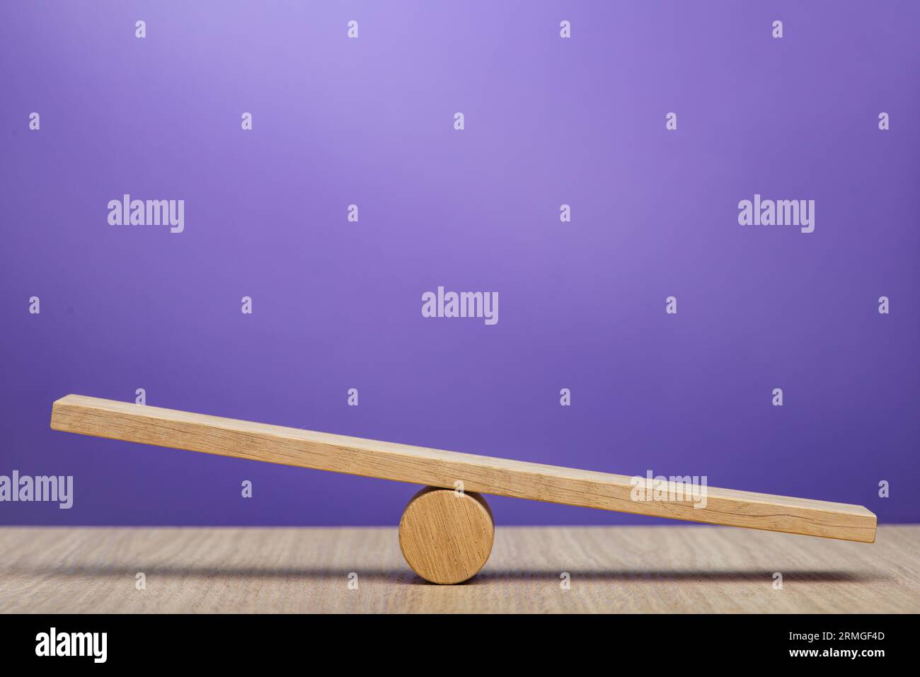 Empty wooden scales on a purple background. The concept of equilibrium ...