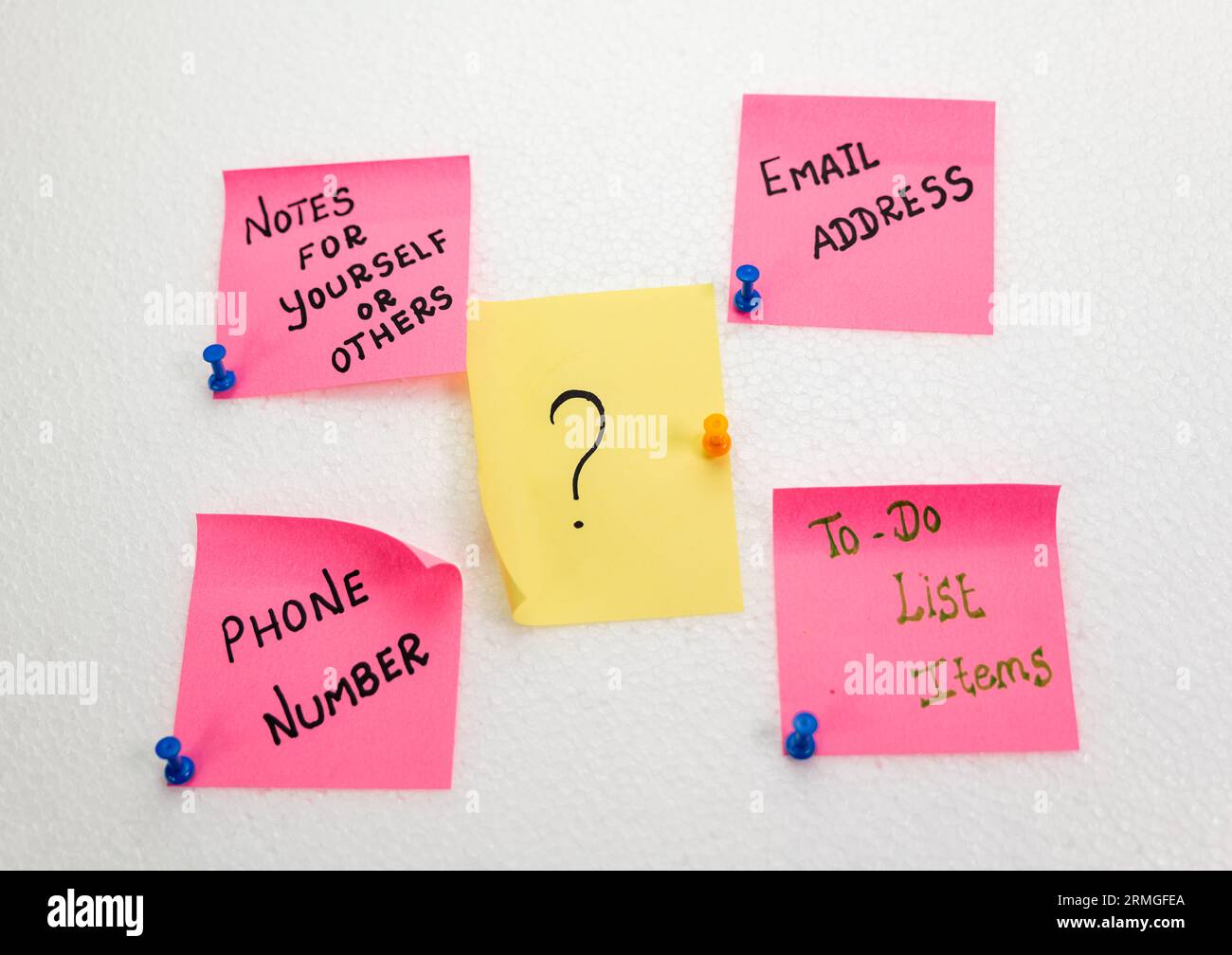 A stack of pink sticky notes with question mark symbols Stock Photo - Alamy