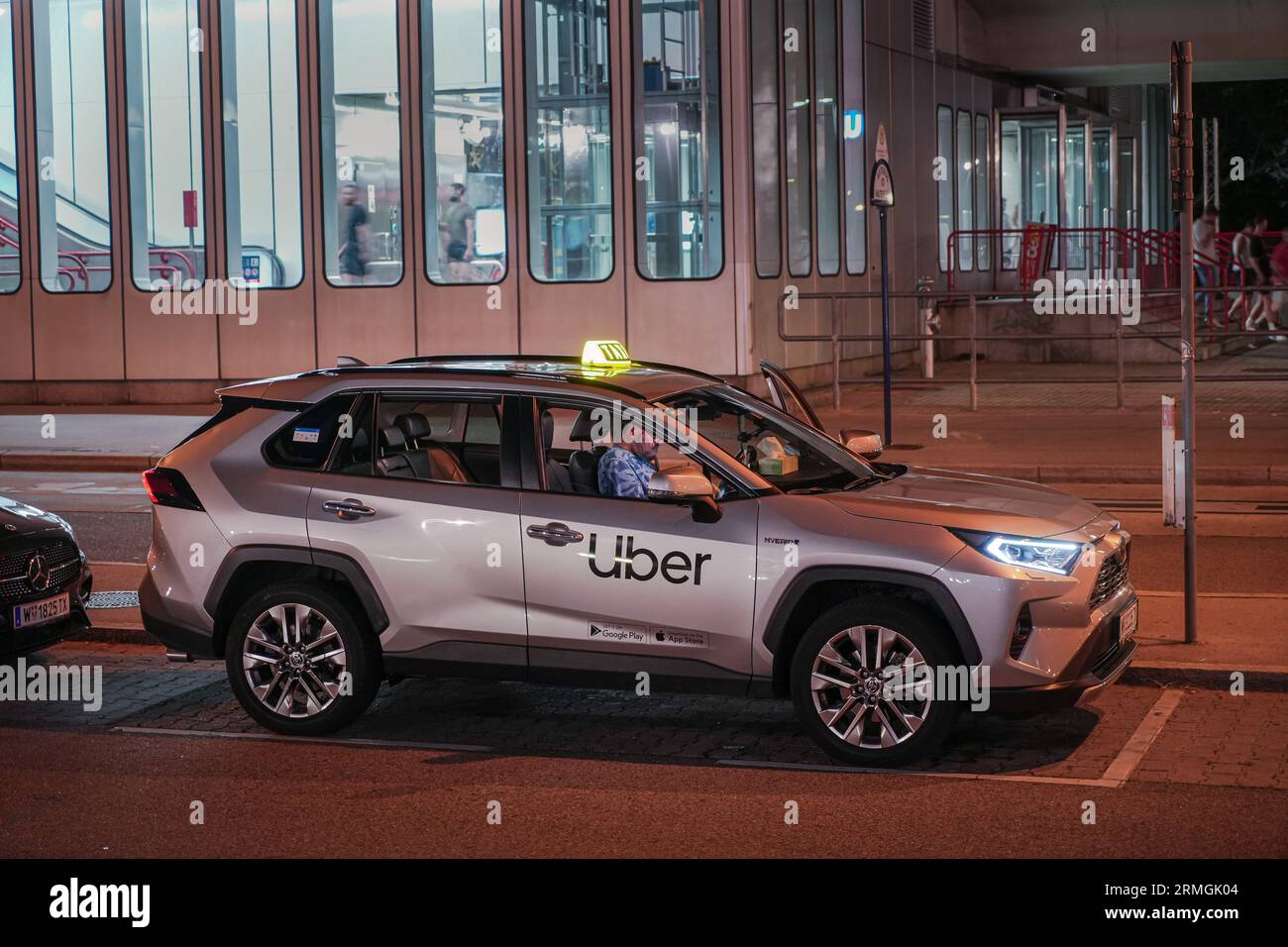 Vienna, Austria - August 2023 : Uber car with logo waiting for a call ...