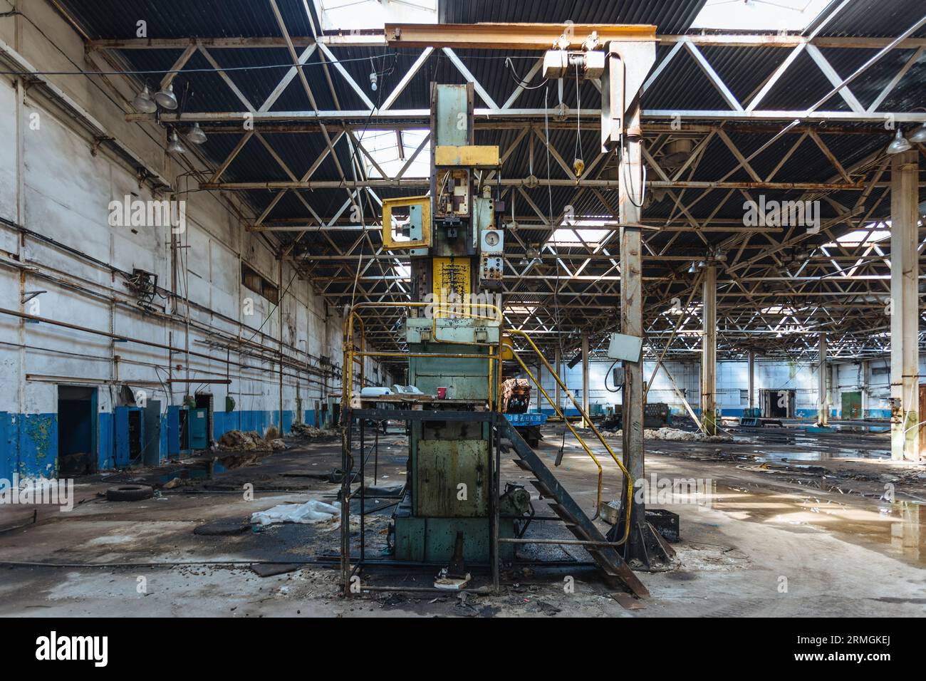Abandoned factory. Large empty ruined industrial hall with broken ...