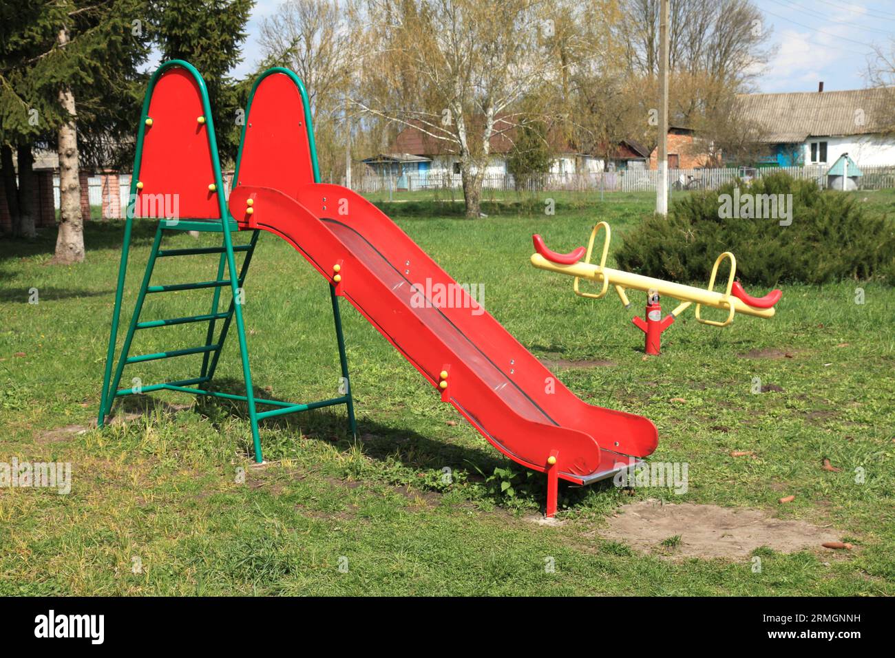 Children's playground in the park. New, modern children's slide and ...