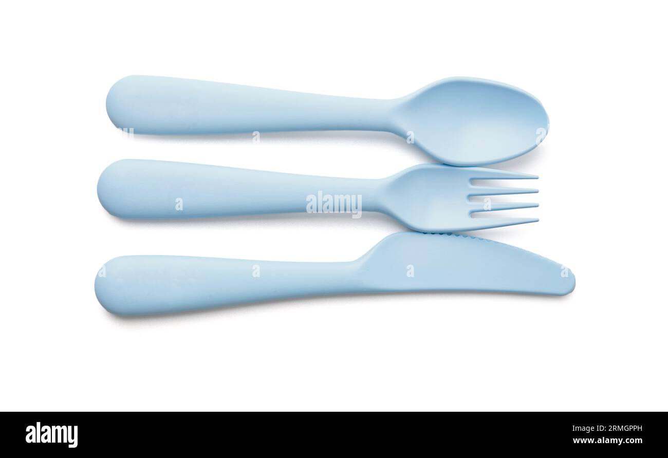 Plastic eating utensils for baby on white background Stock Photo - Alamy