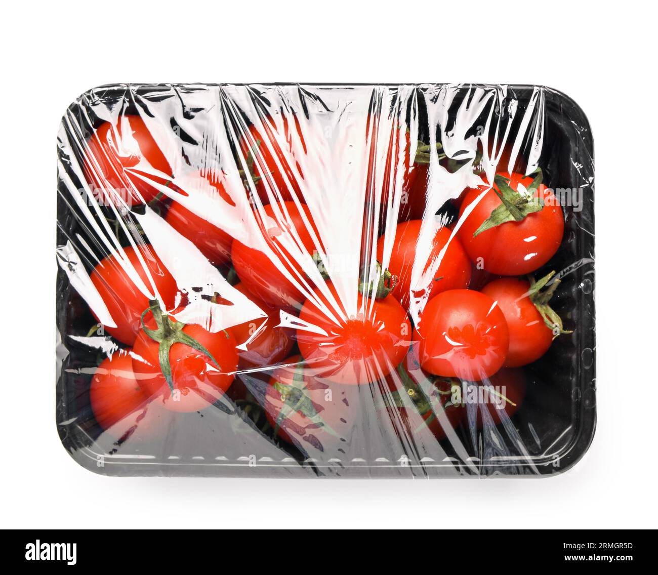 Plastic container of fresh tomatoes wrapped with stretch wrap on white ...