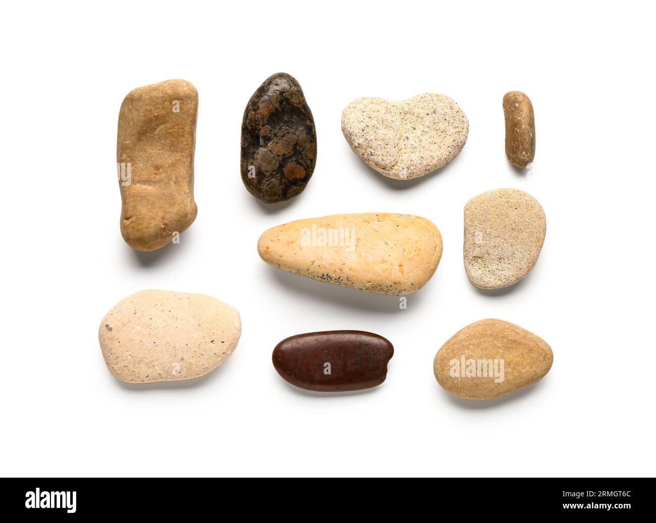 Many pebble stones on white background Stock Photo - Alamy