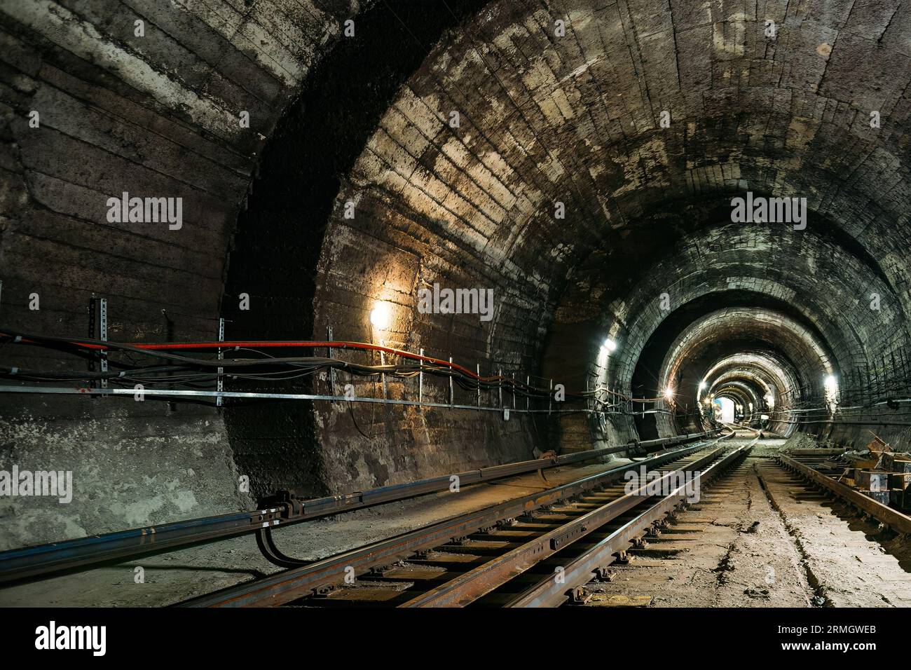 Round underground subway tunnel with tubing Stock Photo - Alamy