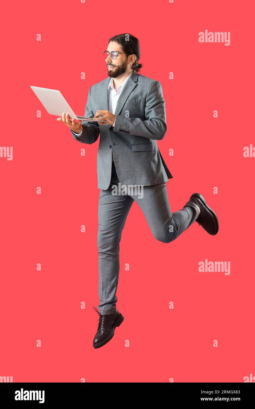 Man suit jumping laptop hi-res stock photography and images - Alamy