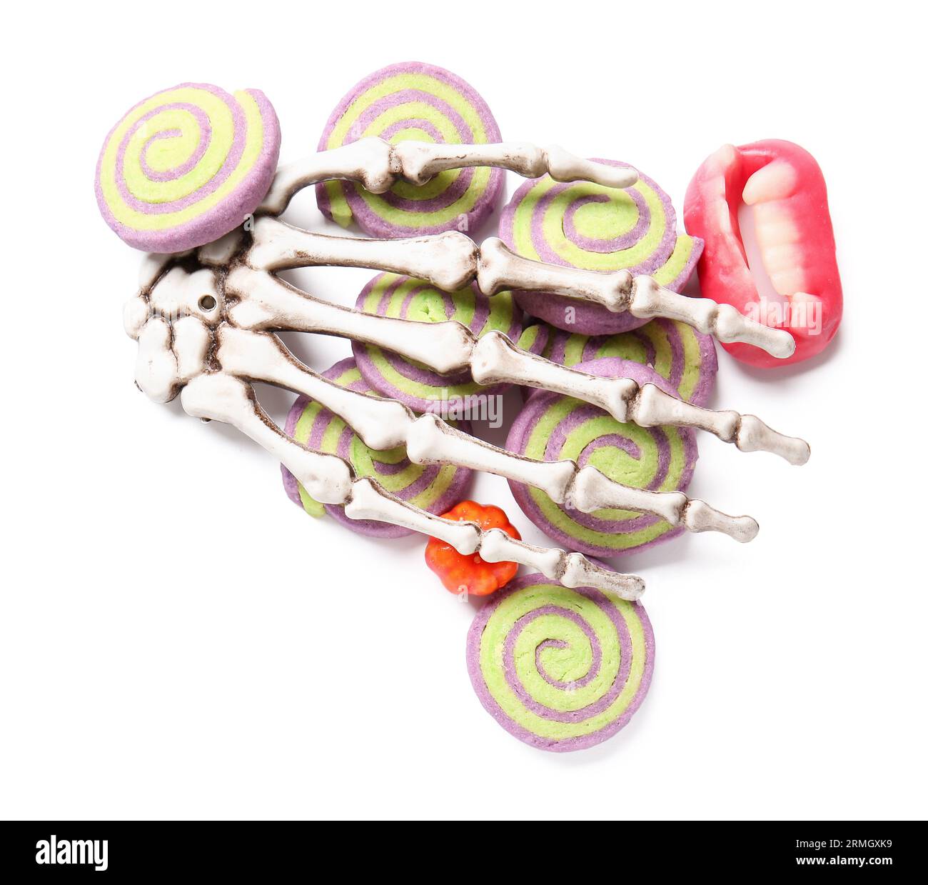 Tasty cookies with scary candies and skeleton hand for Halloween ...