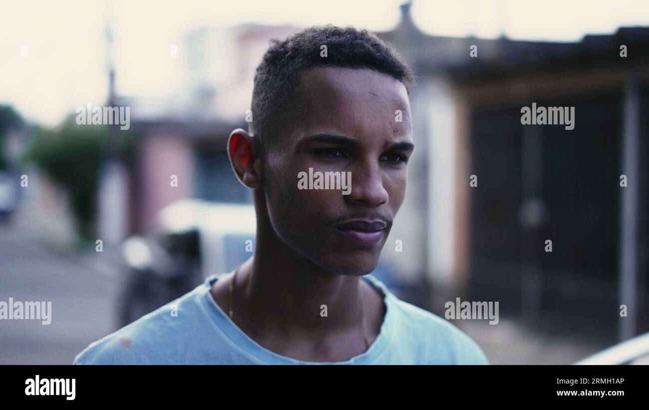 One pensive black man walking forward in street in deep mental ...