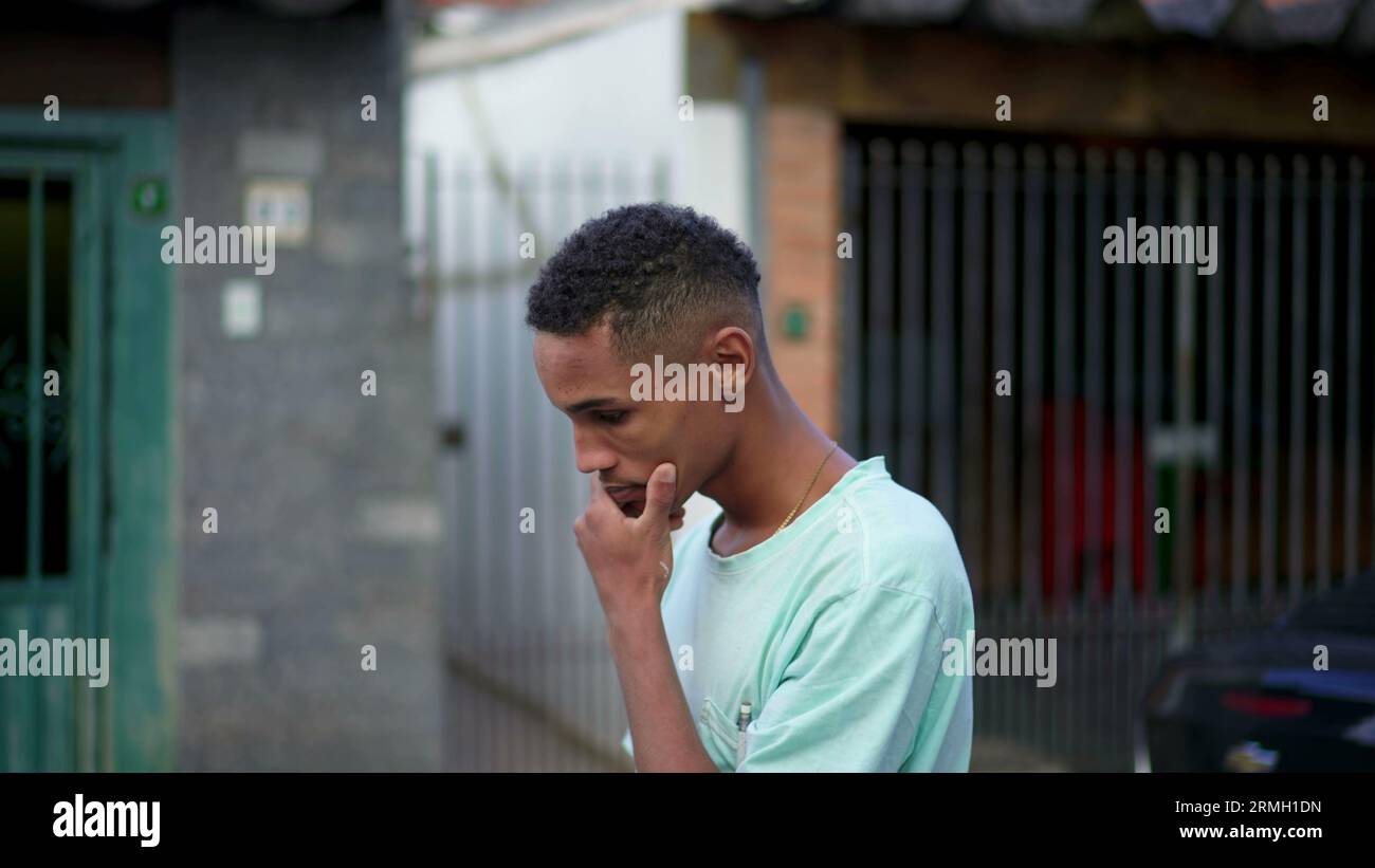 One pensive young black Brazilian man concerned about life while ...