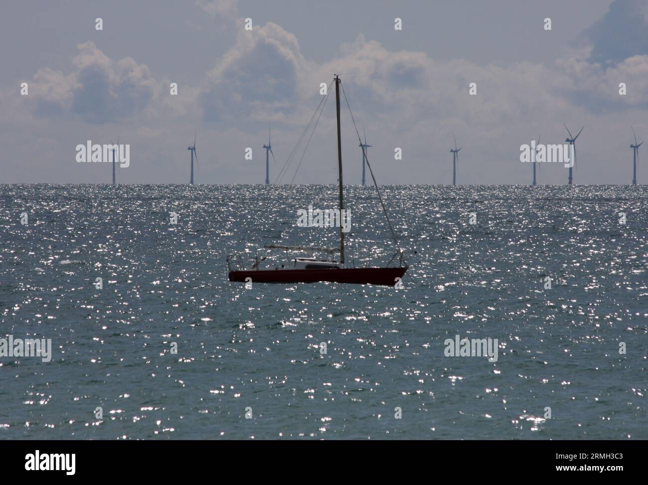 An anchored sailing boat offshore at Shoreham with Rampion Offshore ...