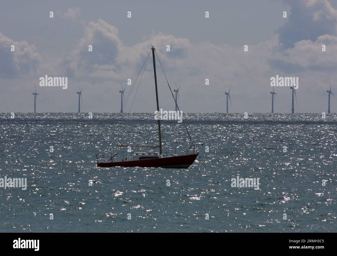 An anchored sailing boat offshore at Shoreham with Rampion Offshore ...