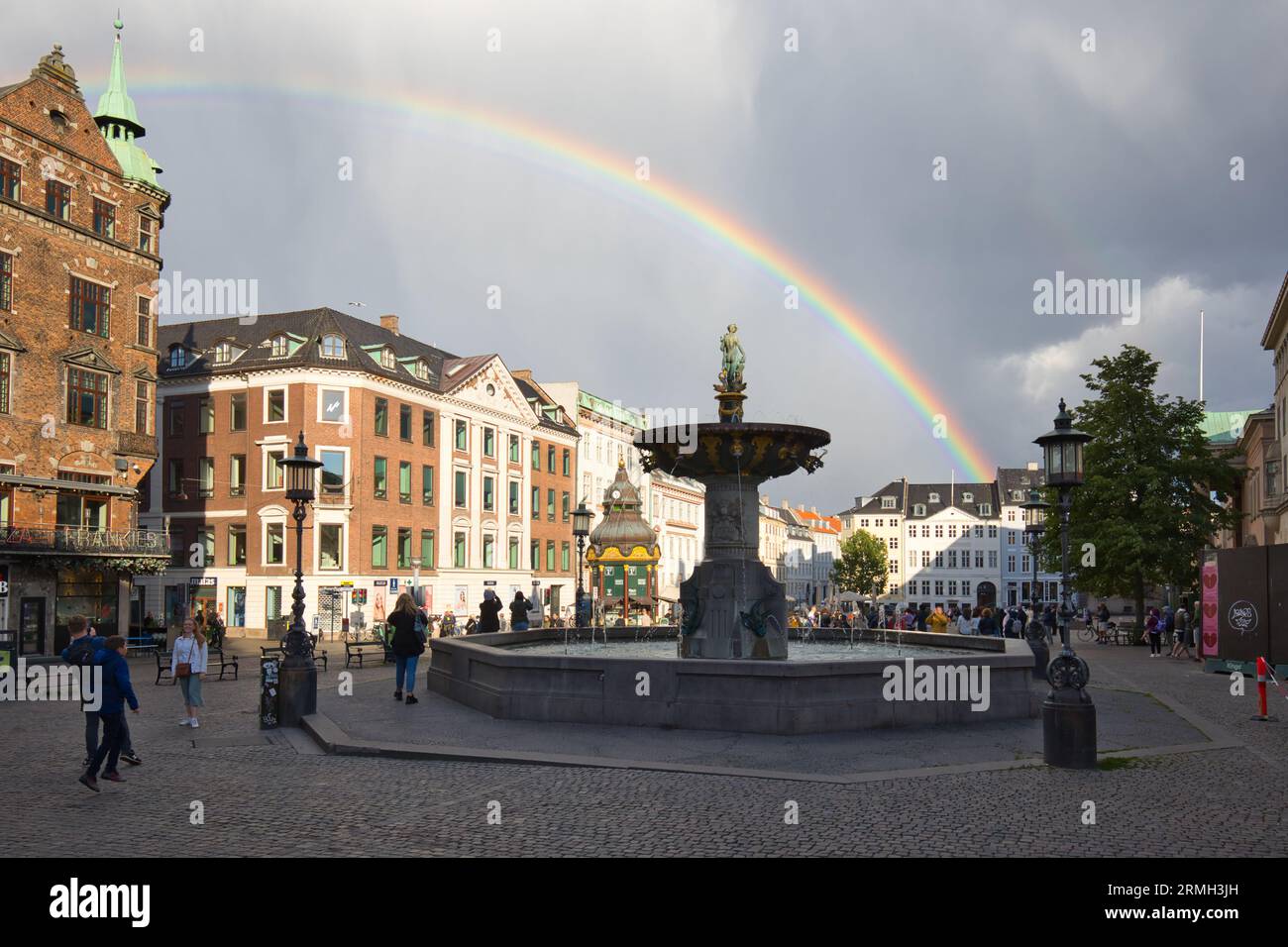 Denmark, Copenhagen - July 03, 2023: Rainbow over Caritas Well, the oldest fountain in ...