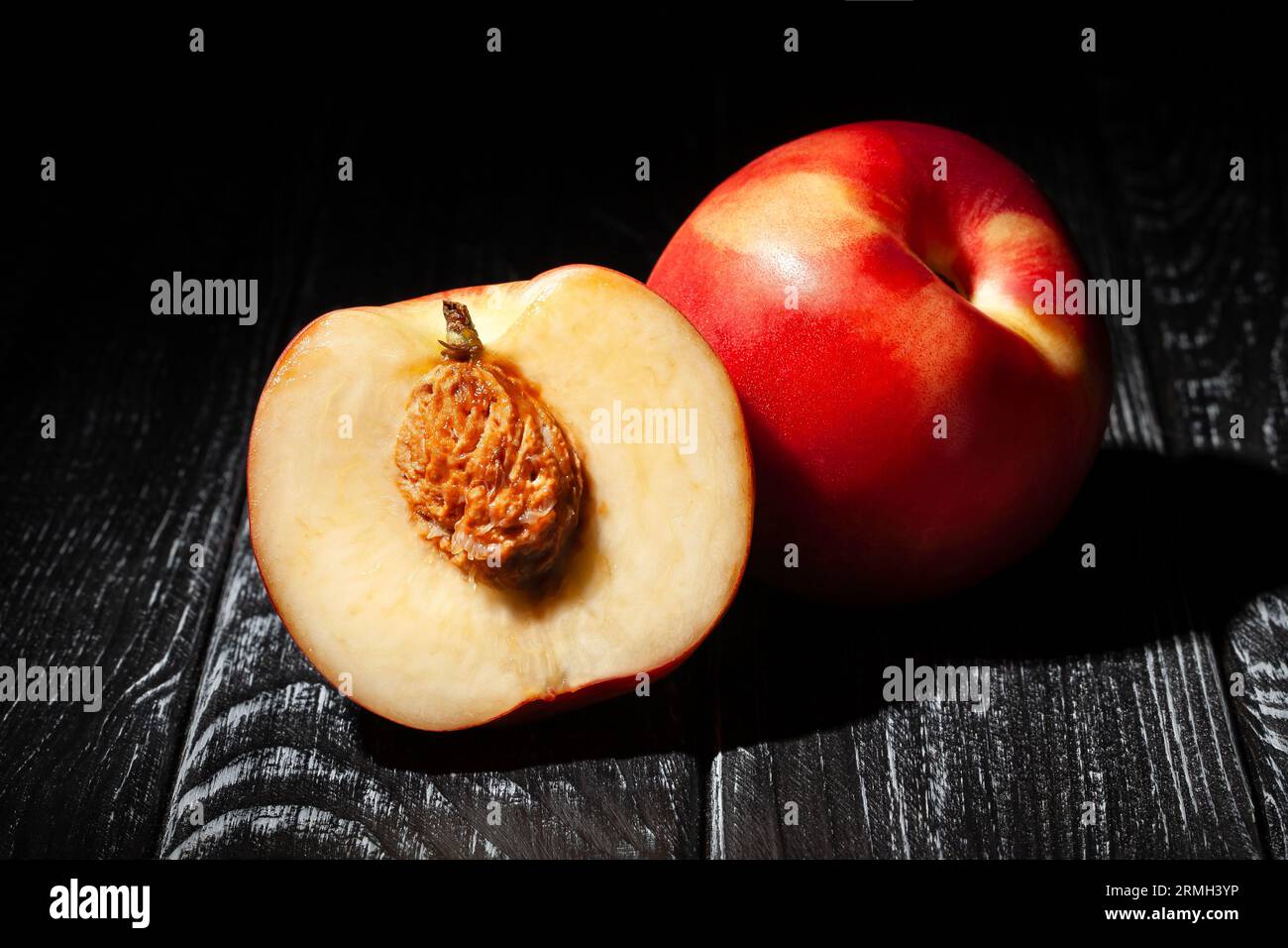 Sliced nectarine on wood hi-res stock photography and images - Alamy