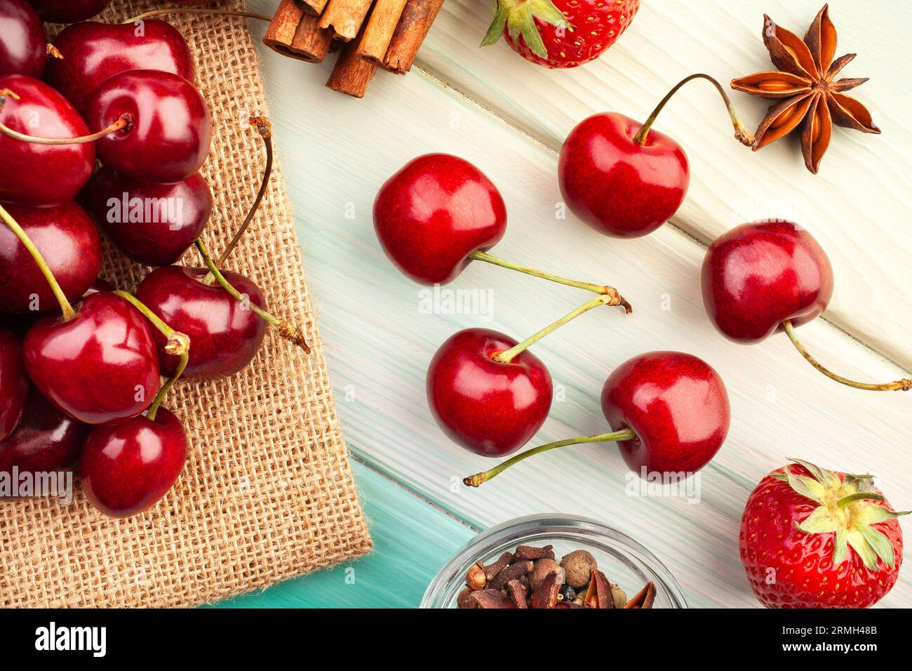 cherry group on wood background Stock Photo - Alamy