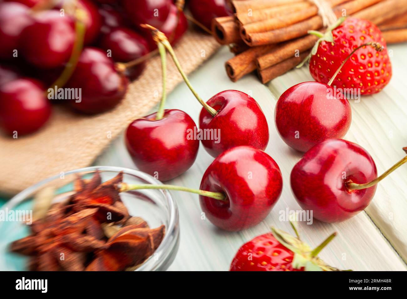 cherry group on wood background Stock Photo - Alamy