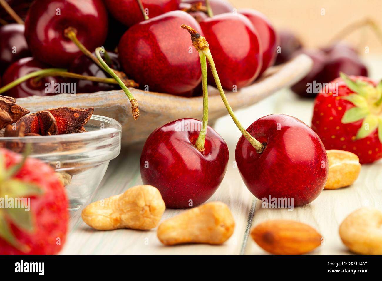 cherry group on wood background Stock Photo - Alamy