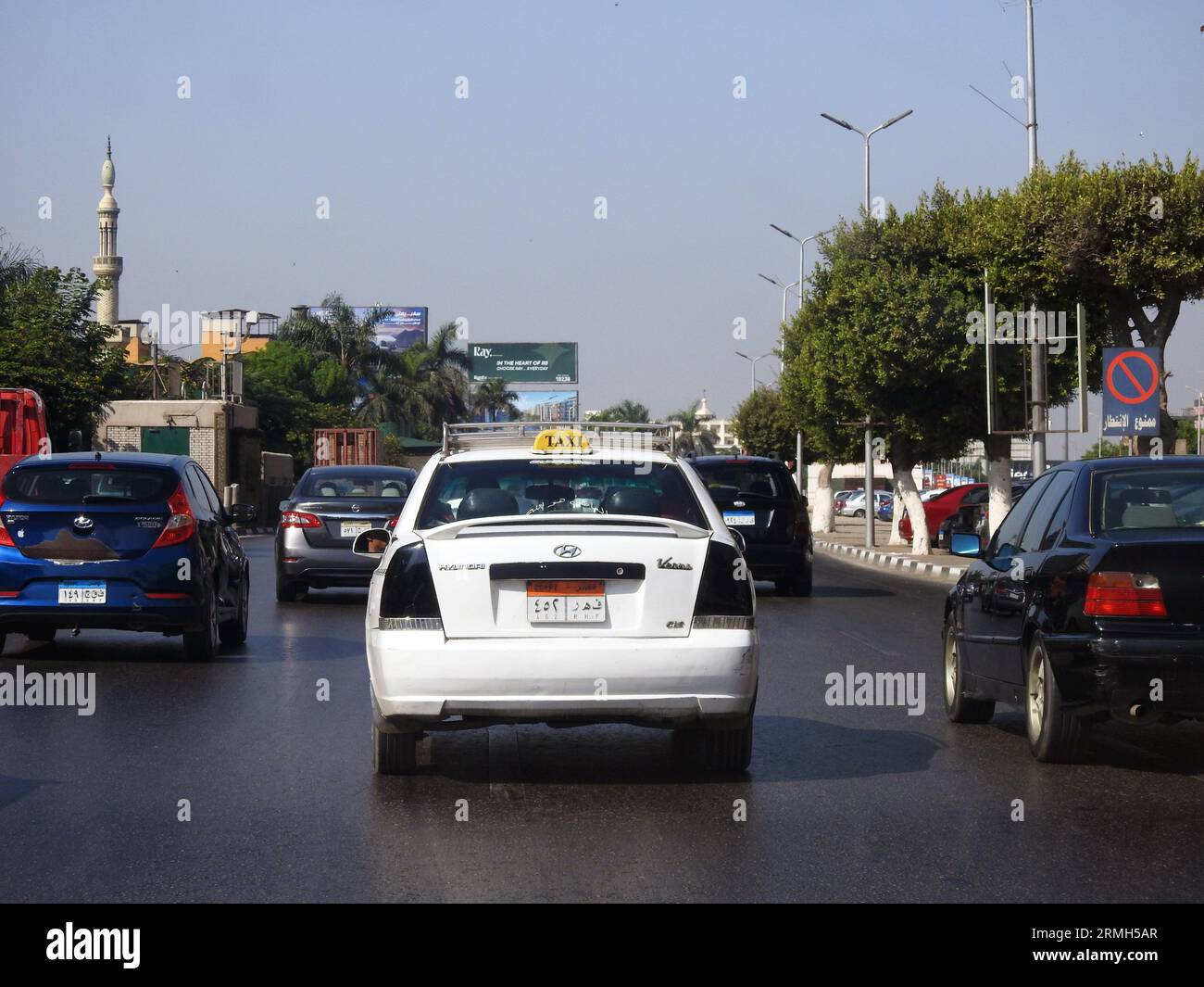 Cairo, Egypt, August 22 2023: Cairo is served by its white taxis which ...