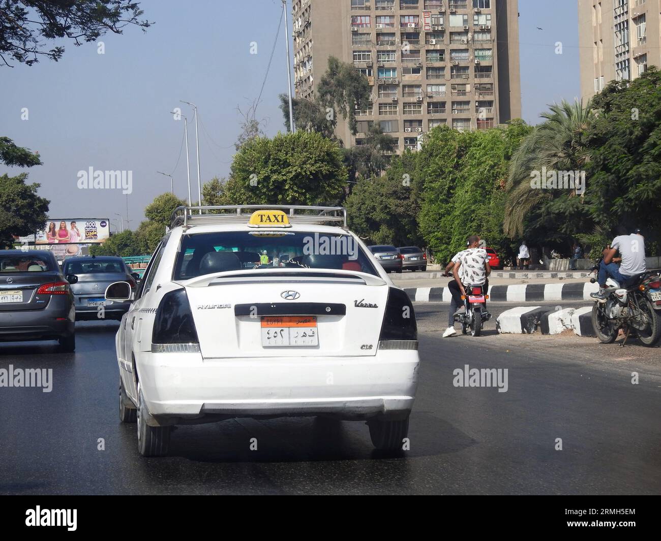 Cairo, Egypt, August 22 2023: Cairo is served by its white taxis which ...