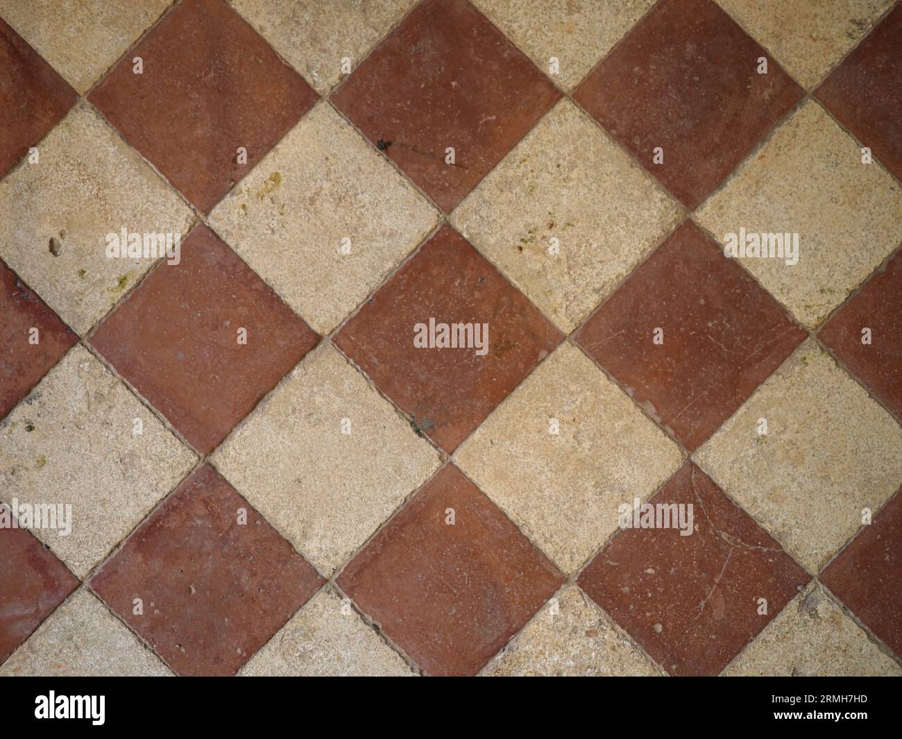 Antique terracotta tiled floor, diamond pattern Stock Photo - Alamy
