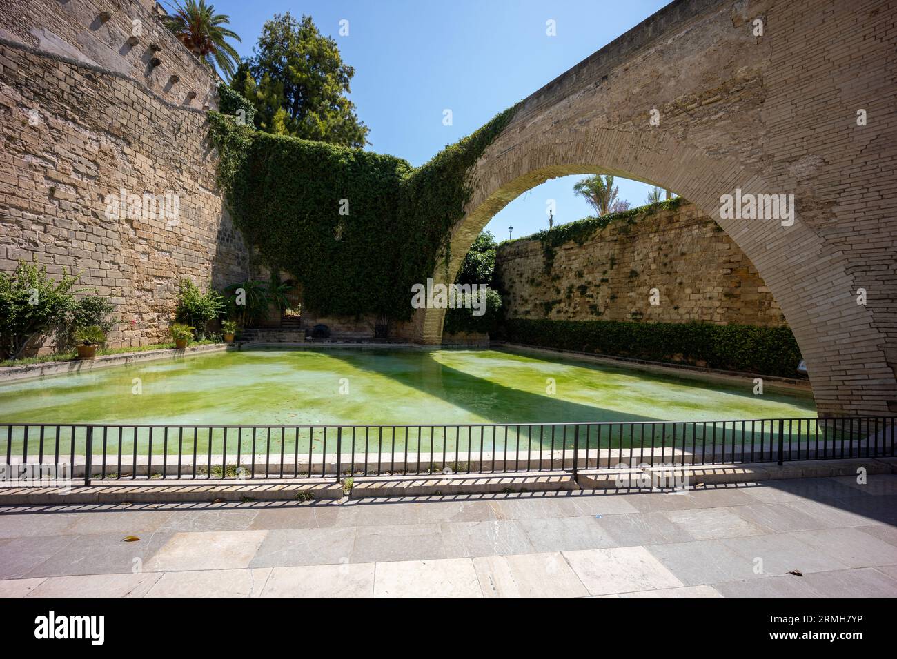 Stone arch on a castle patio on a sunny day Stock Photo - Alamy