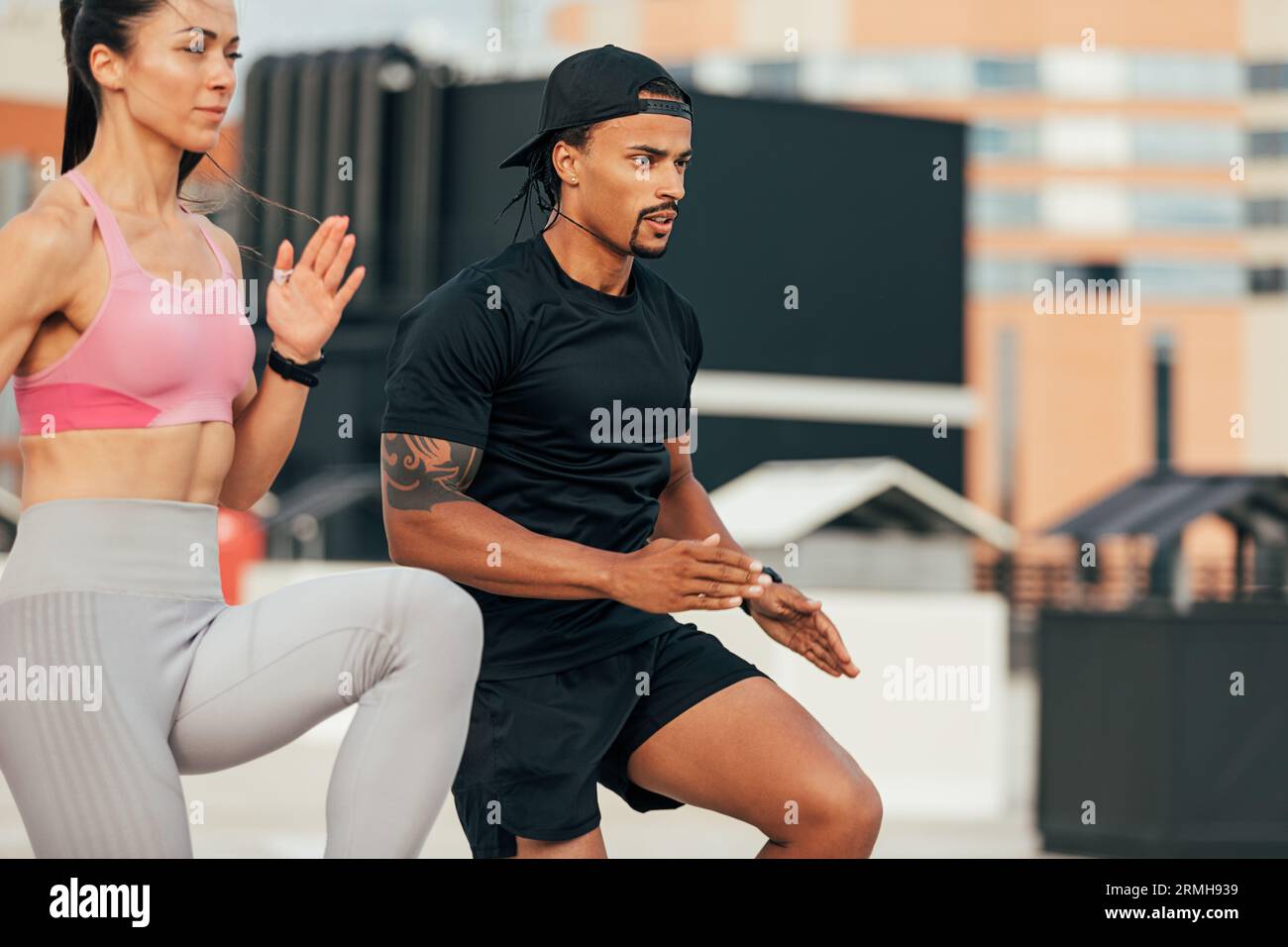 Fitness couple running together. Two people in sportswear exercising on ...