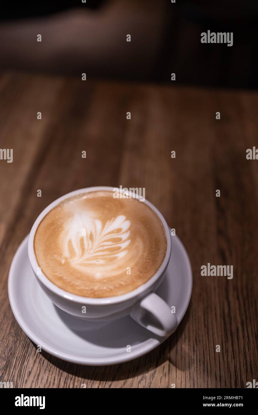 Latte art. ?offee drinks on wooden table background, top view. Banner ...