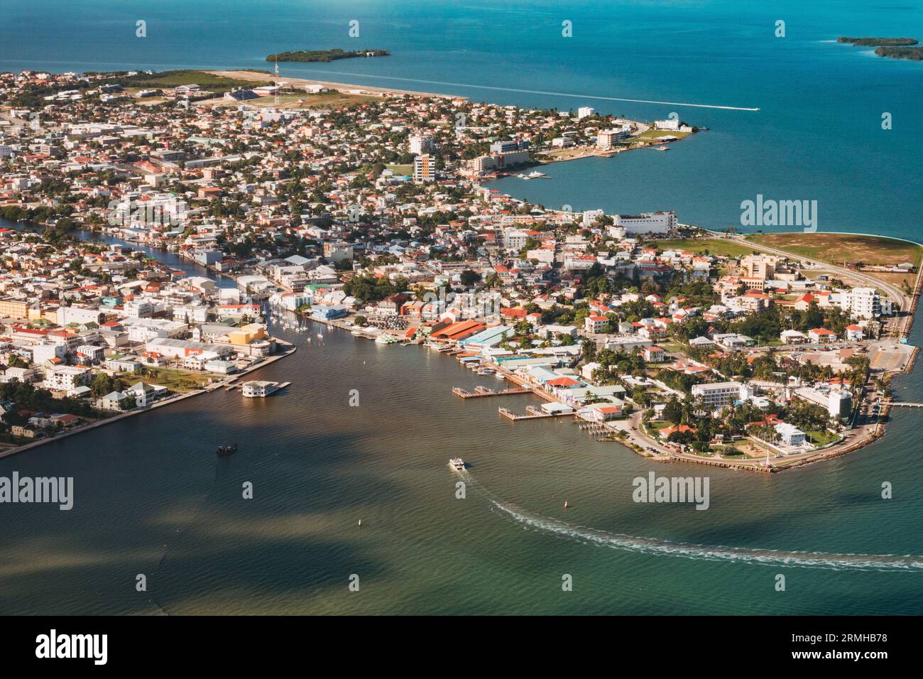 an aerial view the Belize City peninsula and Haulover Creek river mouth ...
