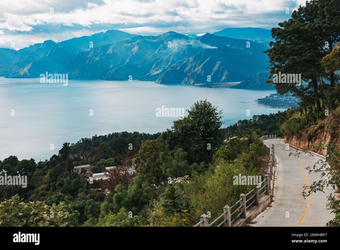 a single lane road descending toward Lake Atitlan, Guatemala Stock ...