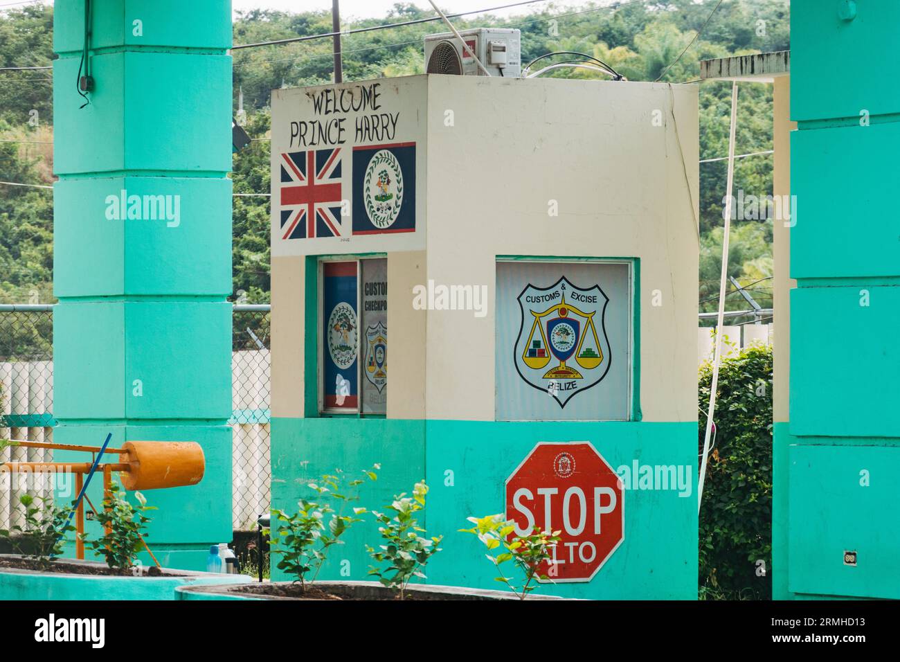 A painted sign saying "Welcome Prince Harry" with a Union Jack on the ...