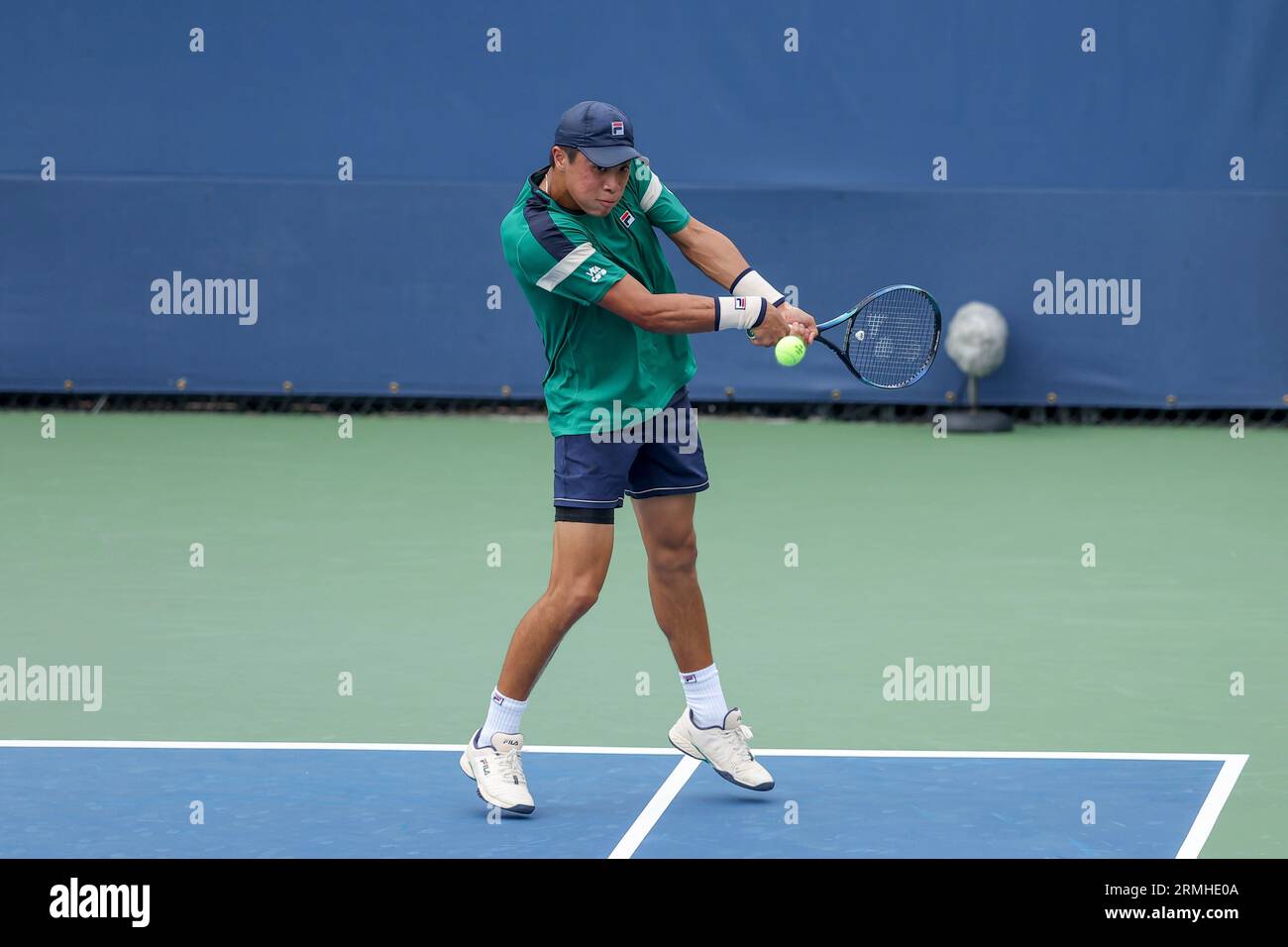 Brandon Nakashima in action during a men's singles match at the 2023 US ...