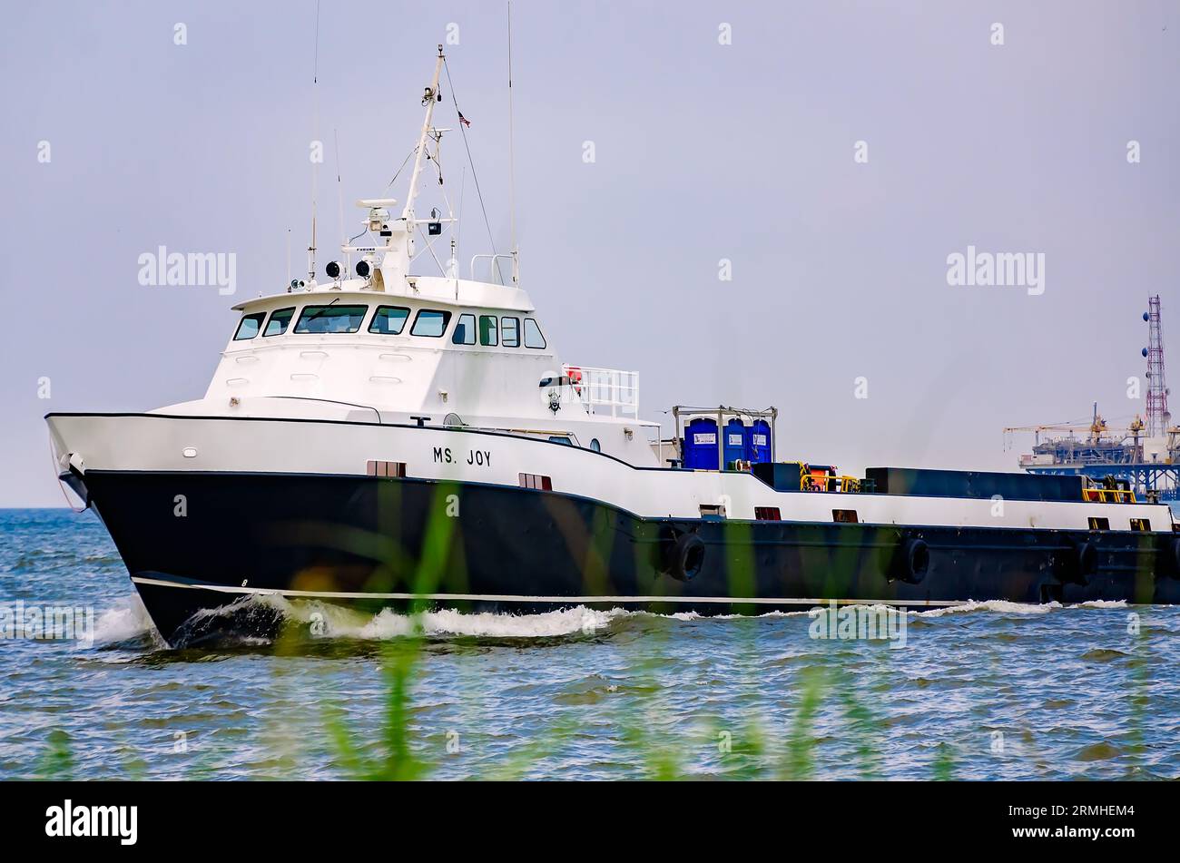 Ms. Joy, a tugboat, heads into port, Aug. 27, 2023, in Dauphin Island ...