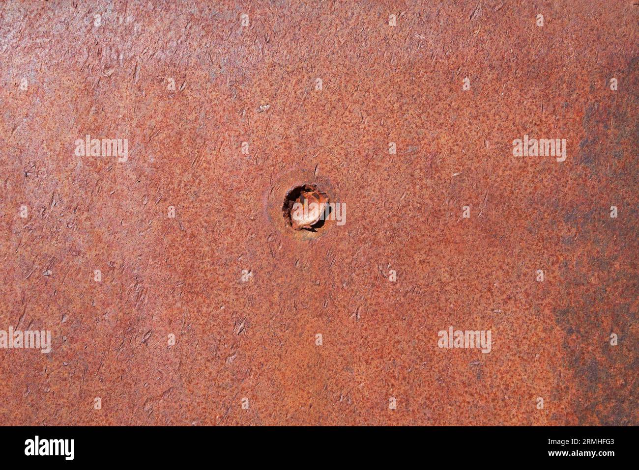 old rusty iron surface with bullet impact crater Stock Photo - Alamy
