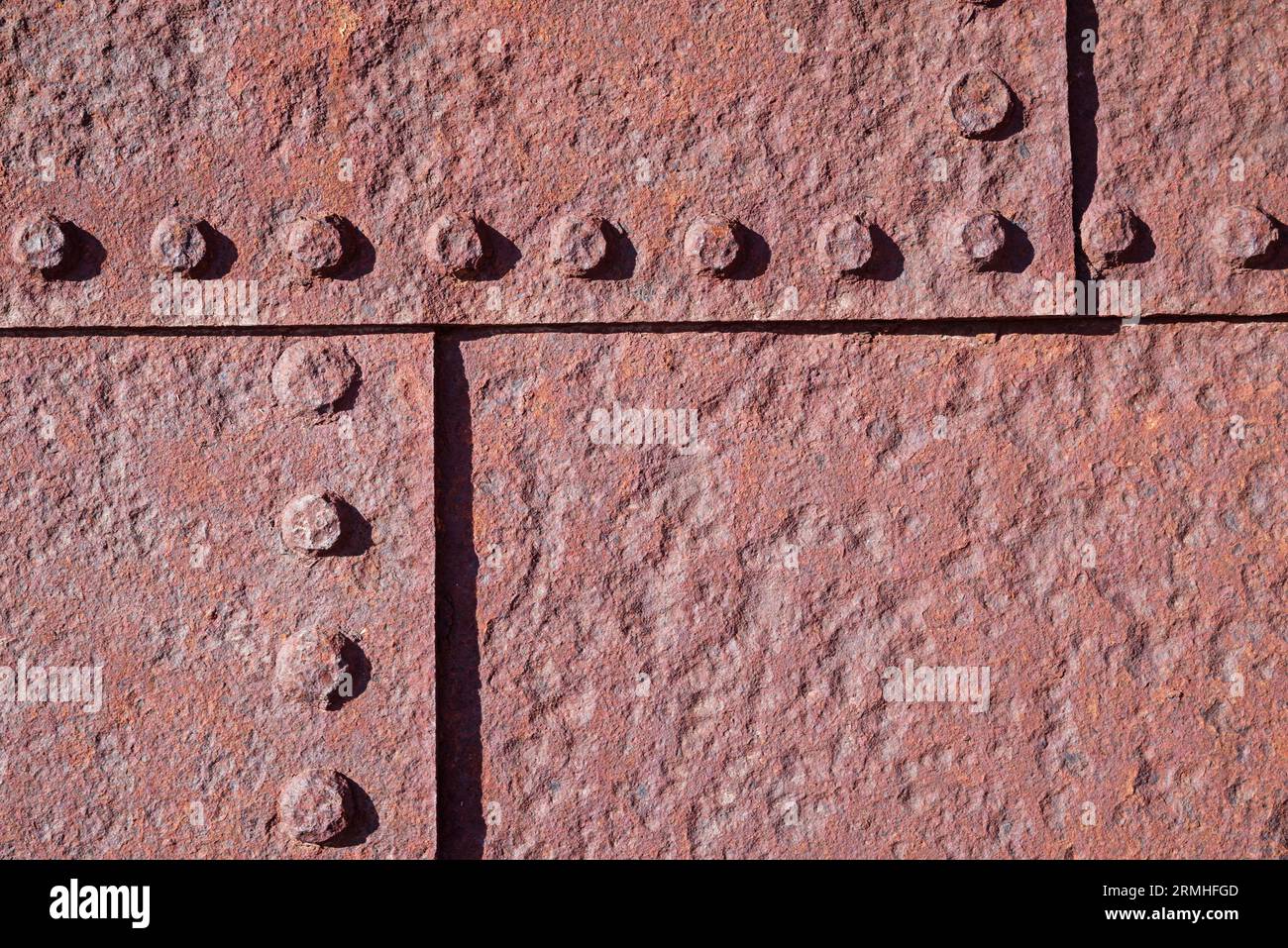 rusty corroded riveted iron metal background Stock Photo - Alamy