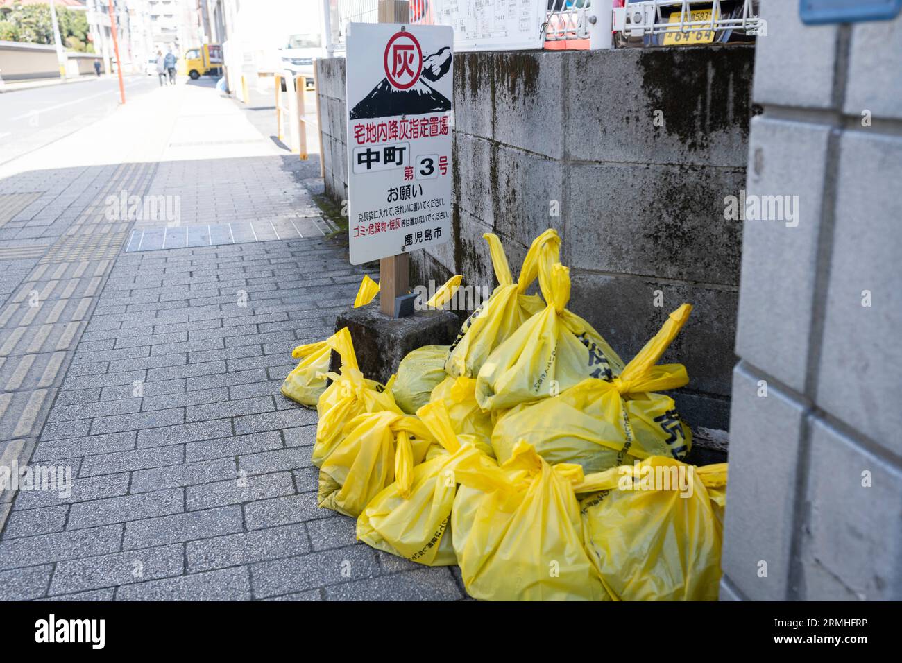 Kagoshima, Japan. 14th Mar, 2023. Bags of volcanic ash at a designated ...