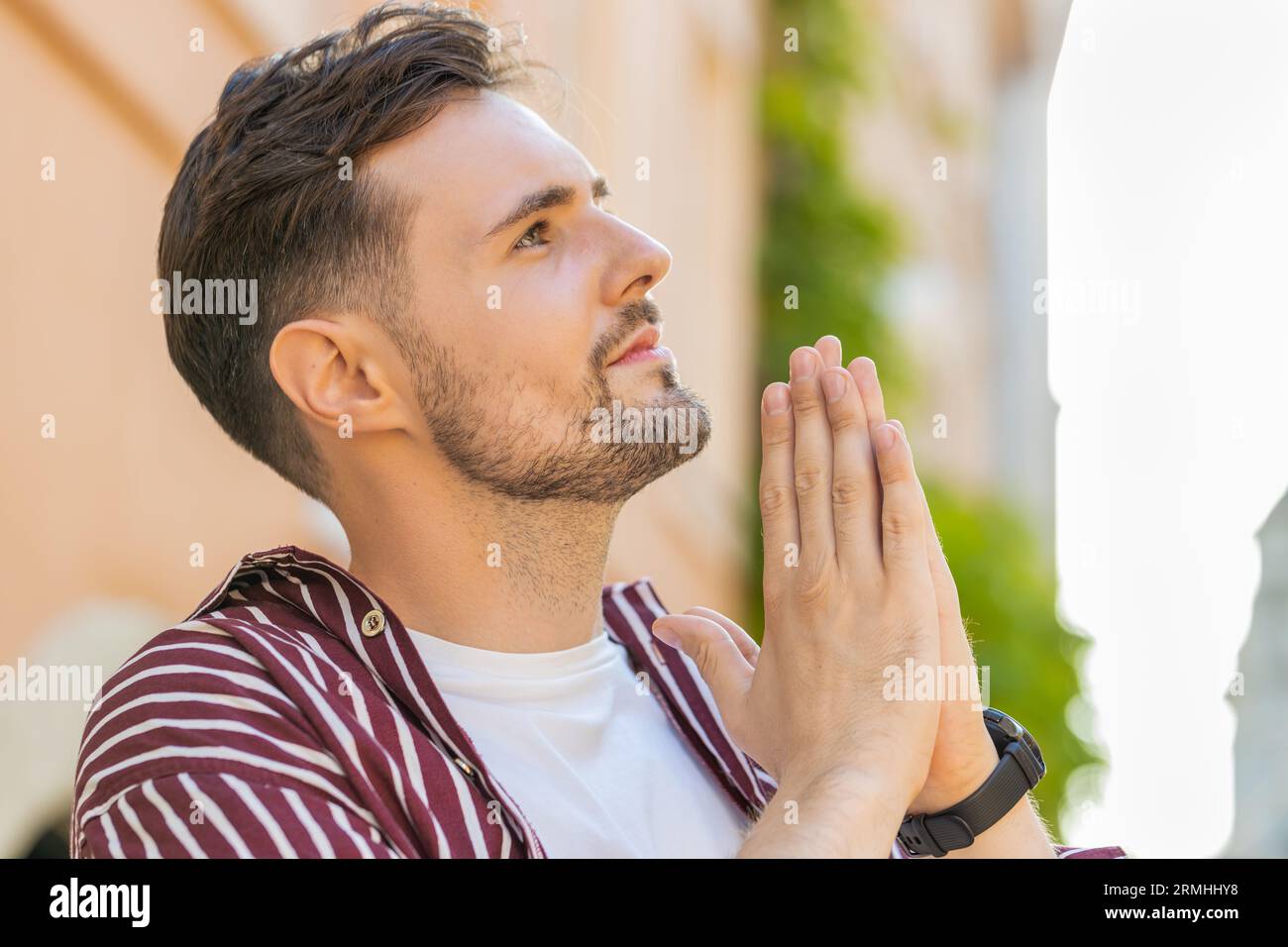 Portrait of religion bearded man praying closed eyes to God asking for ...