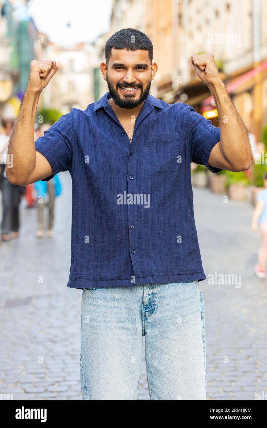 Indian young man shouting celebrating hi-res stock photography and ...
