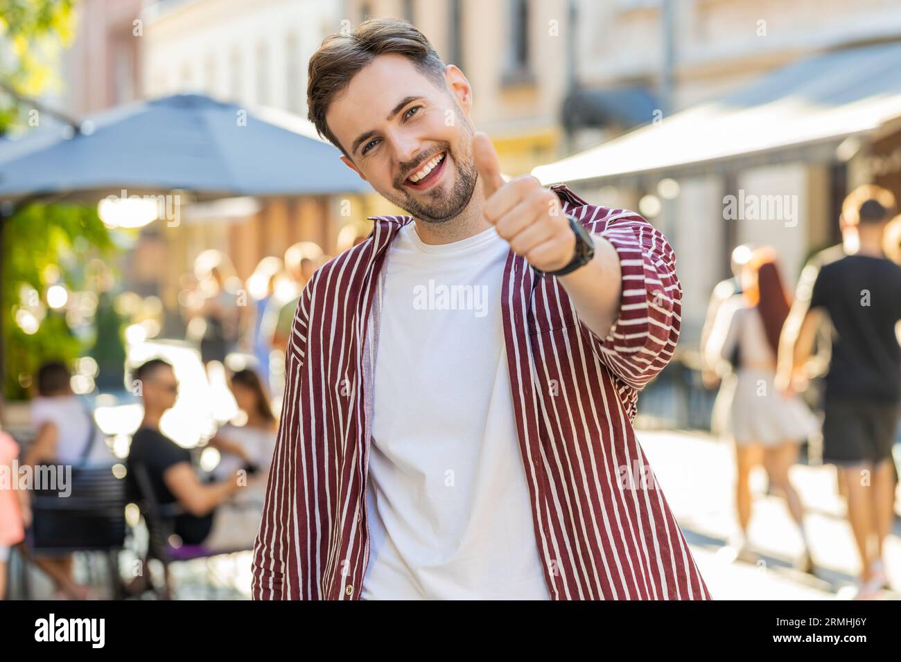 Like. Happy handsome bearded man looking approvingly at camera showing ...