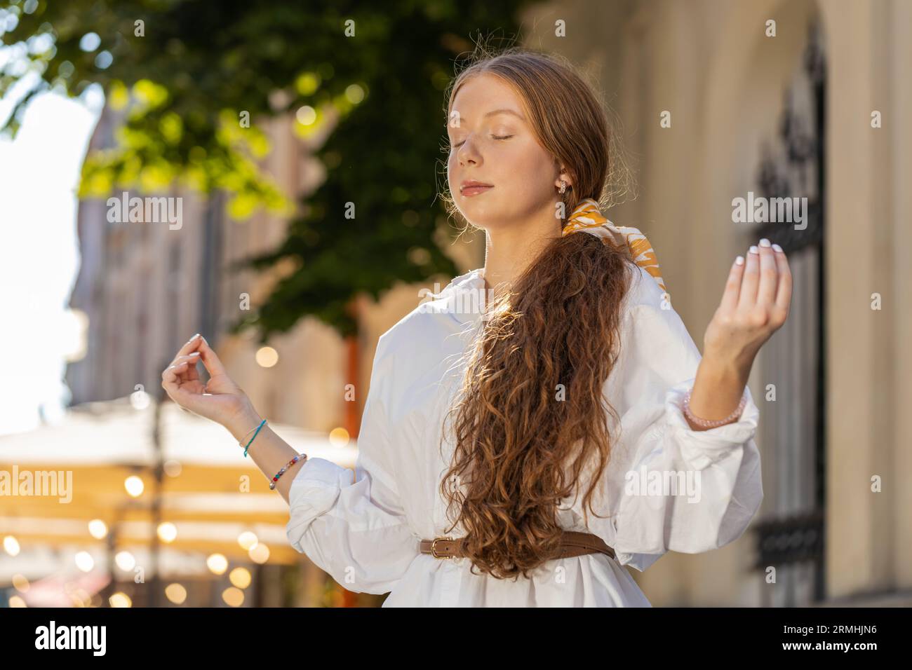Keep calm down, relax. Teenager girl meditating, breathes deeply with ...