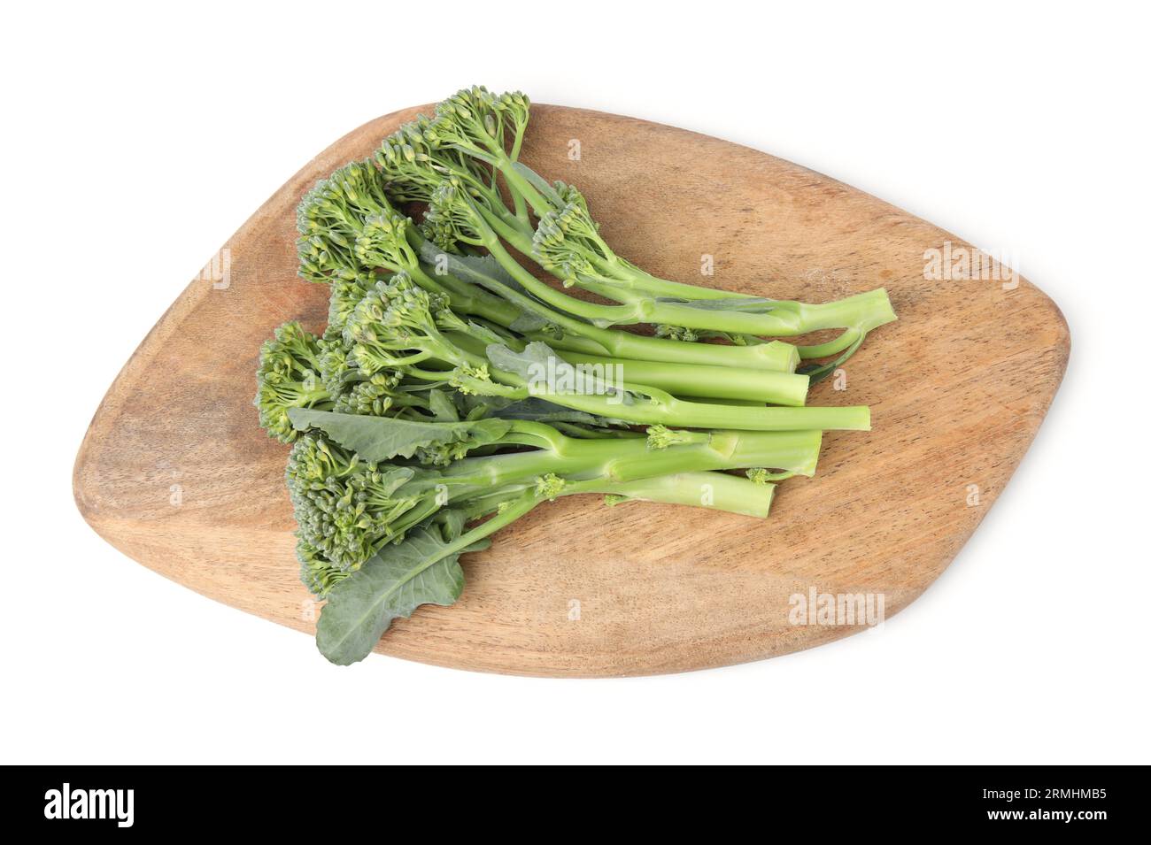 Wooden board with fresh raw broccolini isolated on white, top view ...
