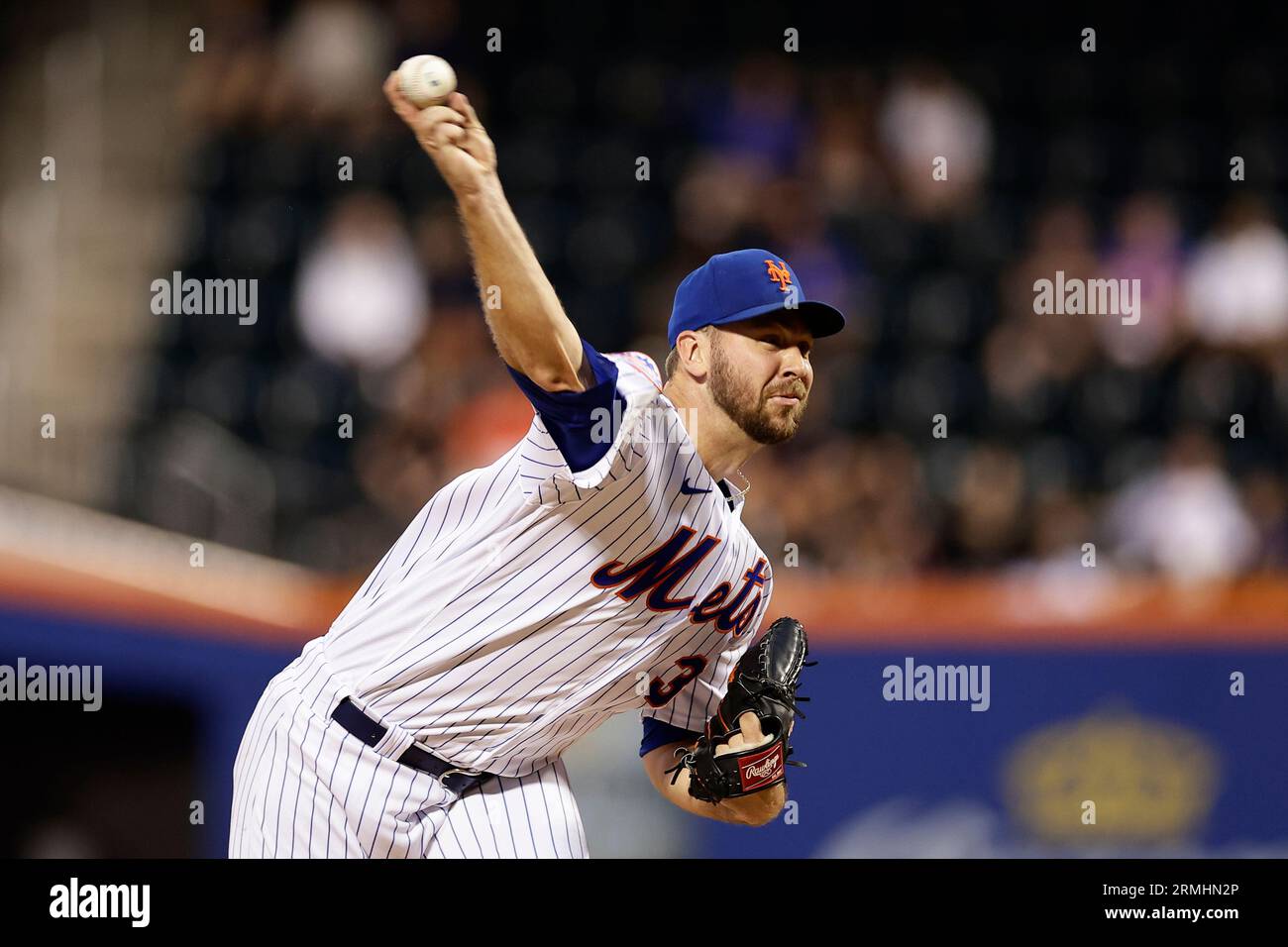 New York Mets pitcher Tylor Megill throws against the Texas Rangers ...