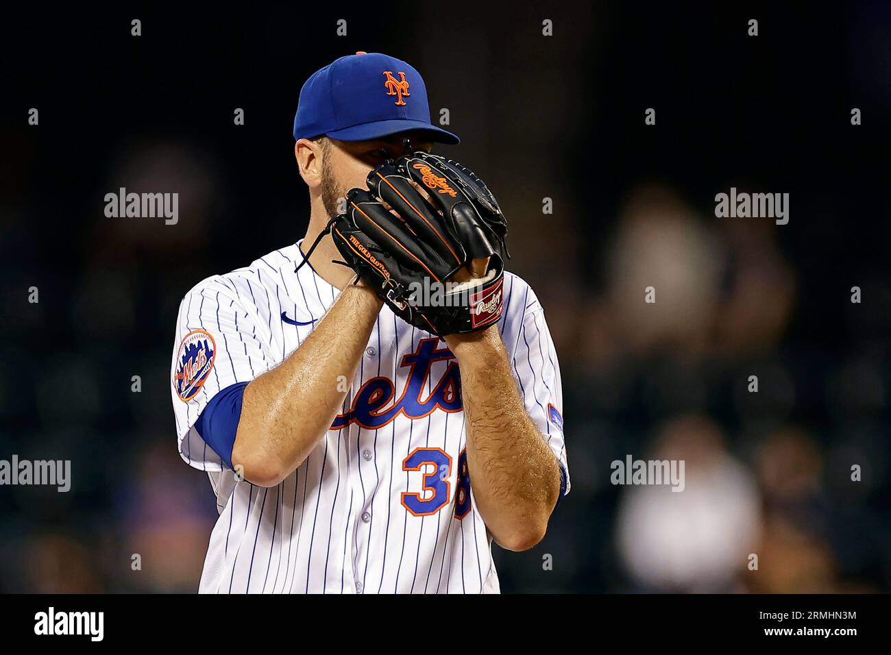 New York Mets pitcher Tylor Megill throws against the Texas Rangers ...
